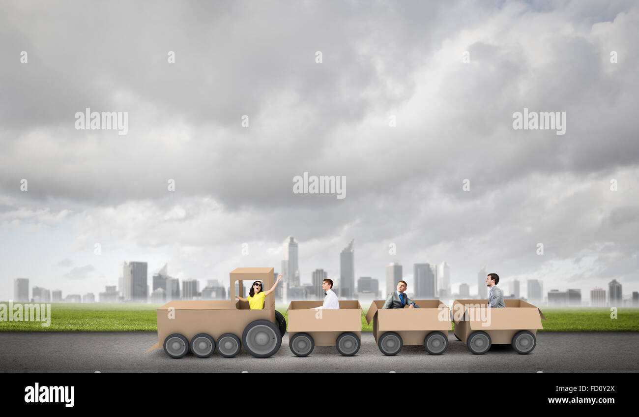 Business people riding carton train. Teamwork concept Stock Photo - Alamy
