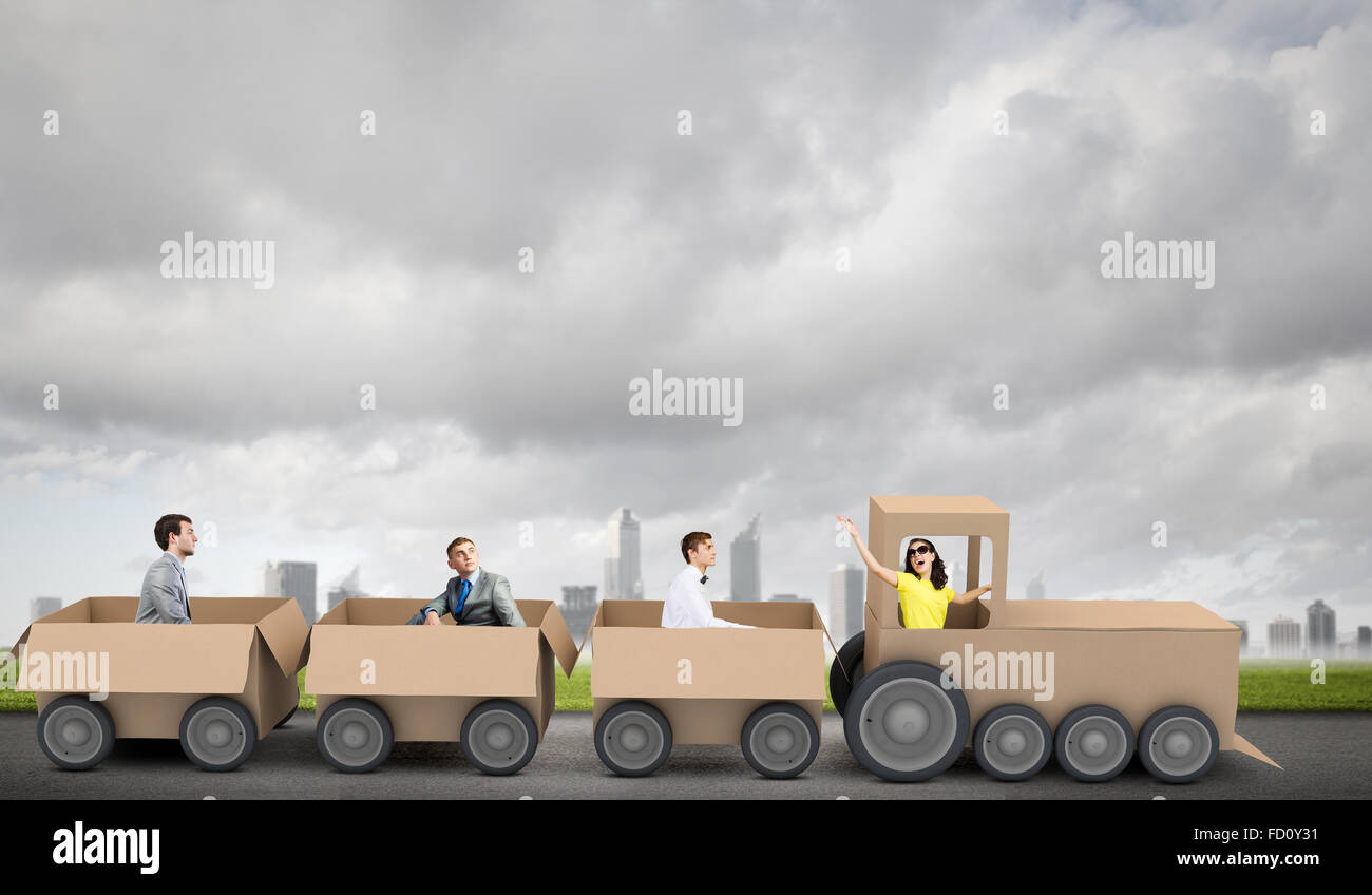 Business people riding carton train. Teamwork concept Stock Photo - Alamy