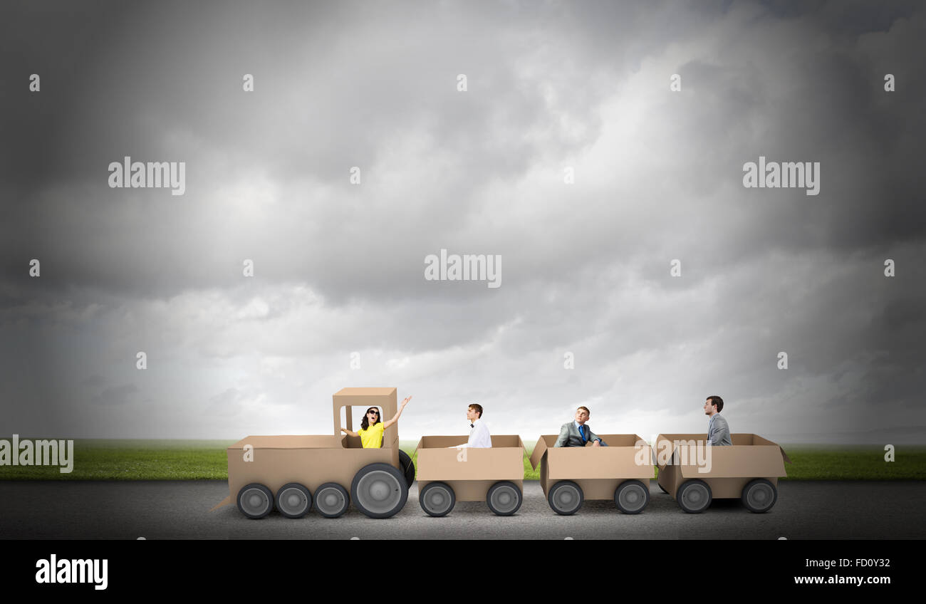 Business people riding carton train. Teamwork concept Stock Photo - Alamy