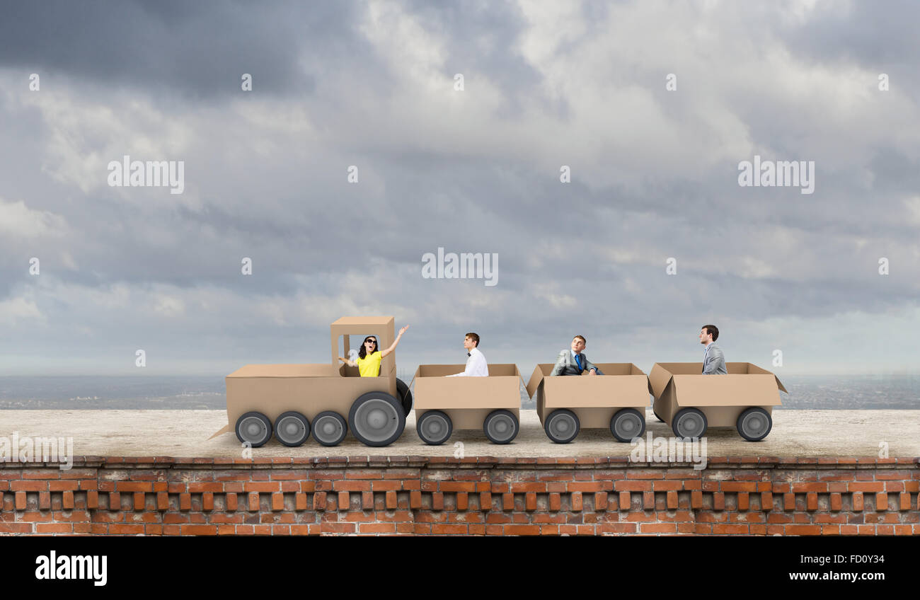 Business people riding carton train. Teamwork concept Stock Photo - Alamy