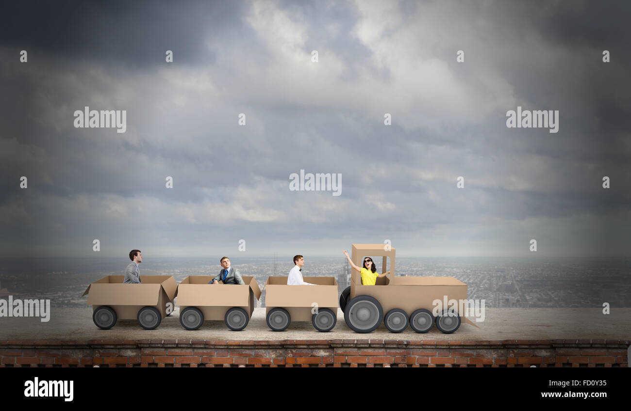 Business people riding carton train. Teamwork concept Stock Photo - Alamy