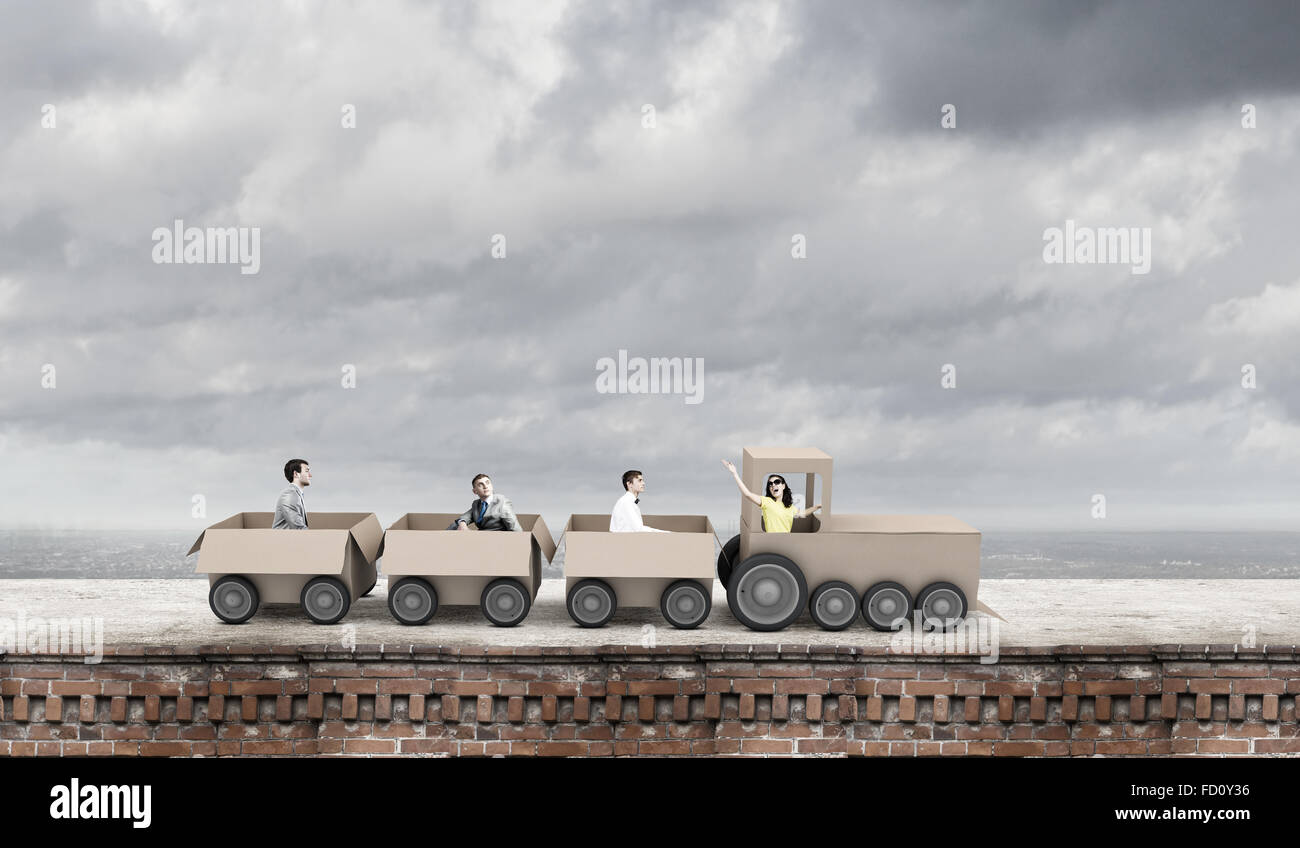 Business people riding carton train. Teamwork concept Stock Photo - Alamy