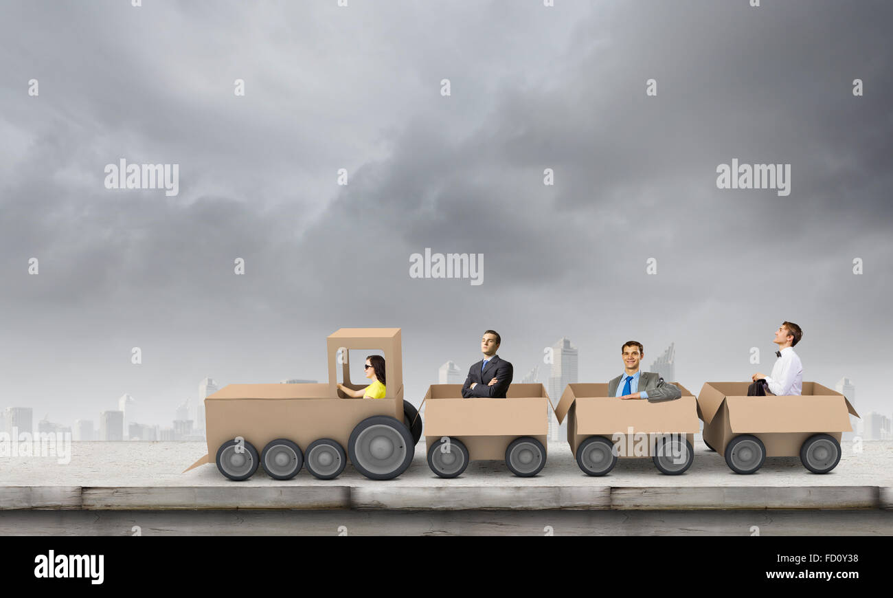 Business people riding carton train. Teamwork concept Stock Photo - Alamy