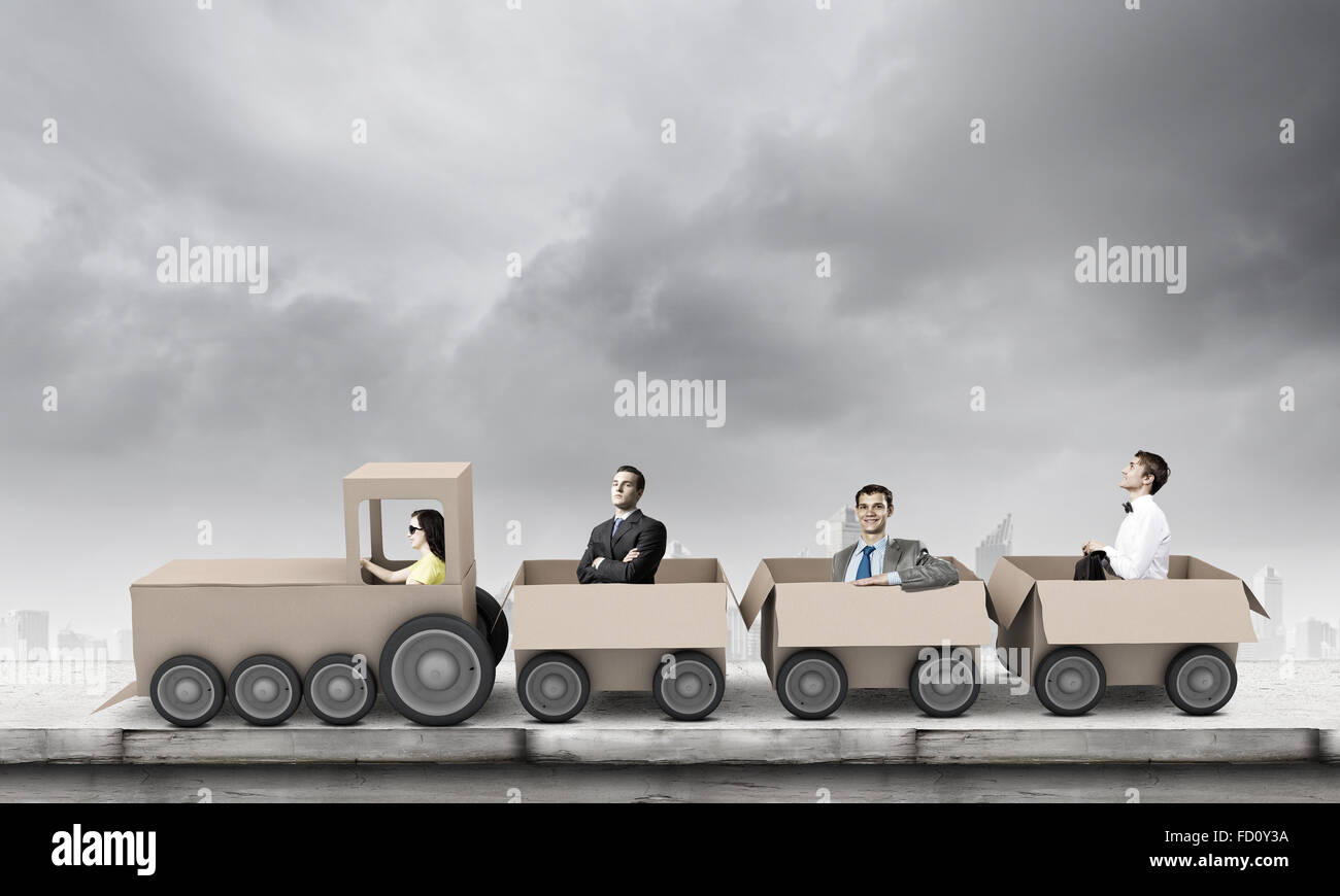 Business people riding carton train. Teamwork concept Stock Photo - Alamy