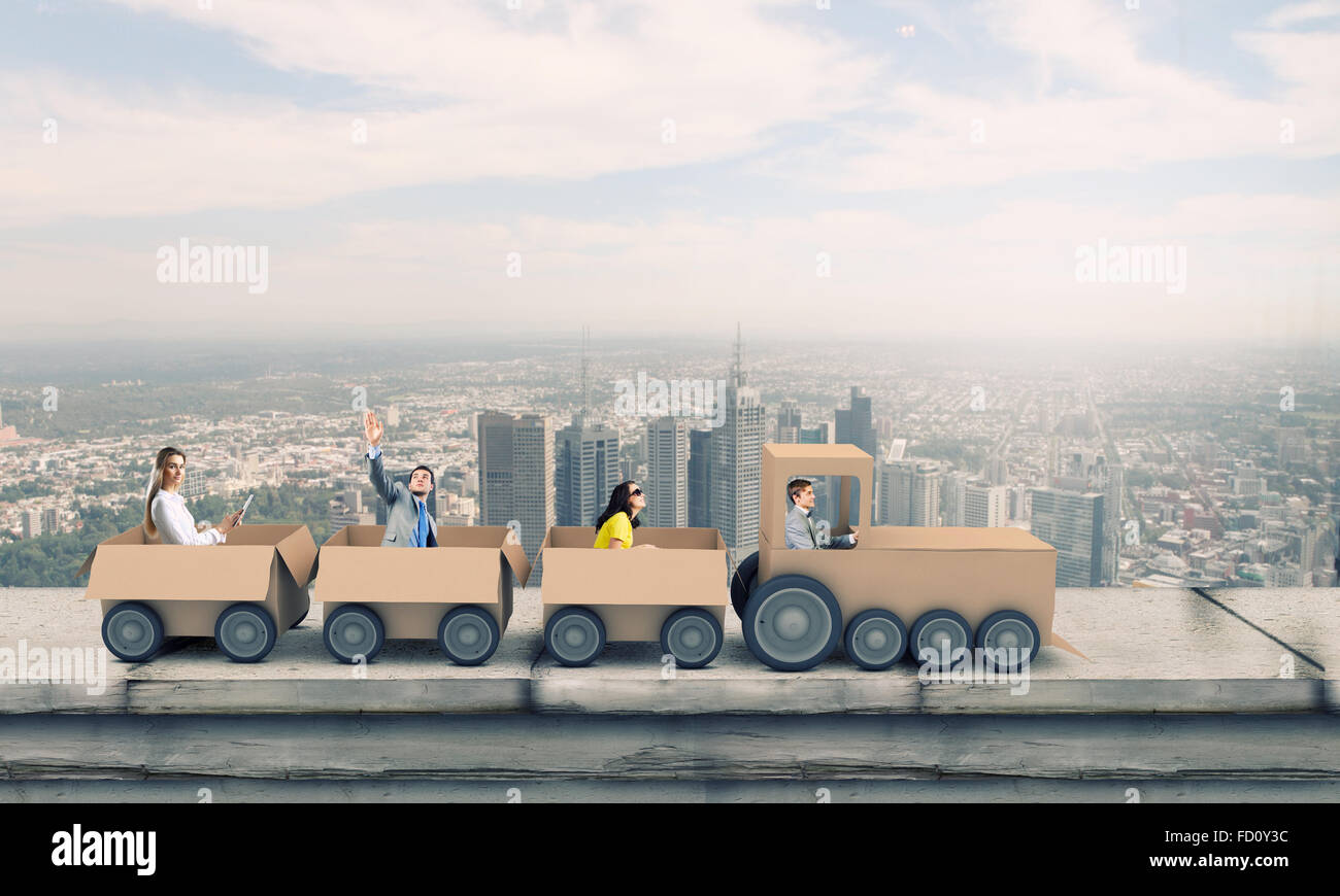 Business people riding carton train. Teamwork concept Stock Photo - Alamy