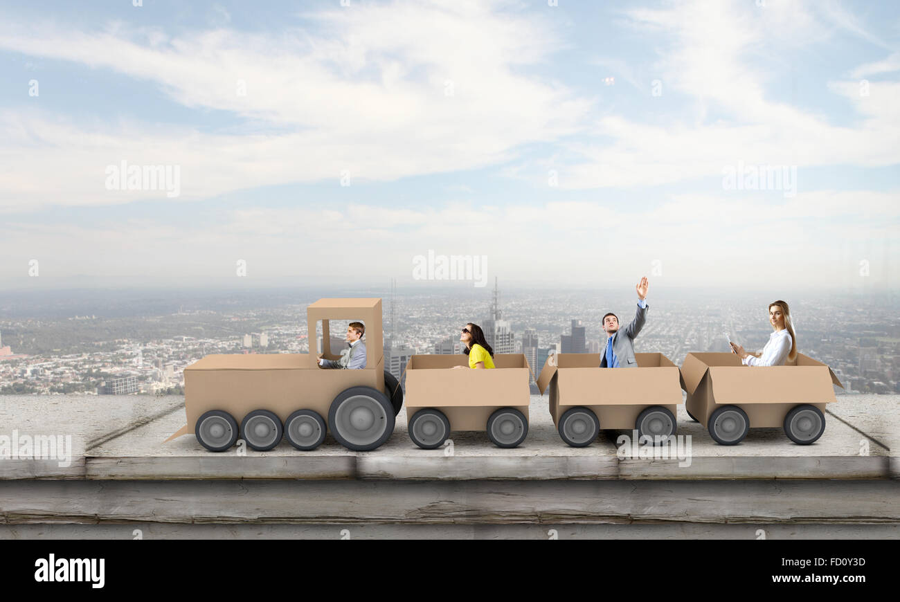 Business people riding carton train. Teamwork concept Stock Photo - Alamy