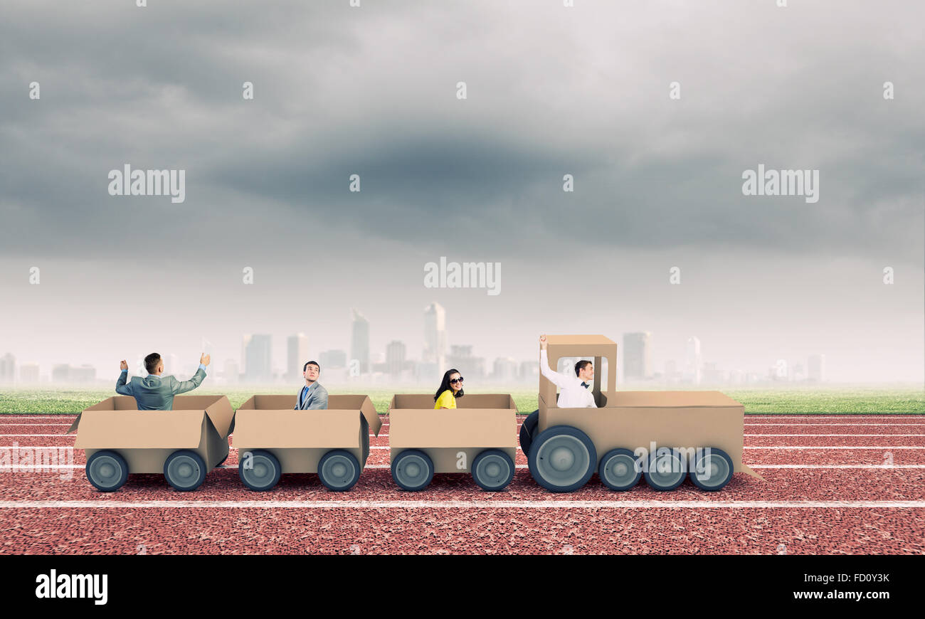 Business people riding carton train. Teamwork concept Stock Photo - Alamy