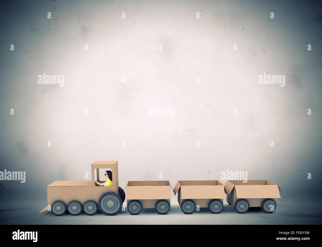 Young woman riding carton train. Women in business Stock Photo - Alamy