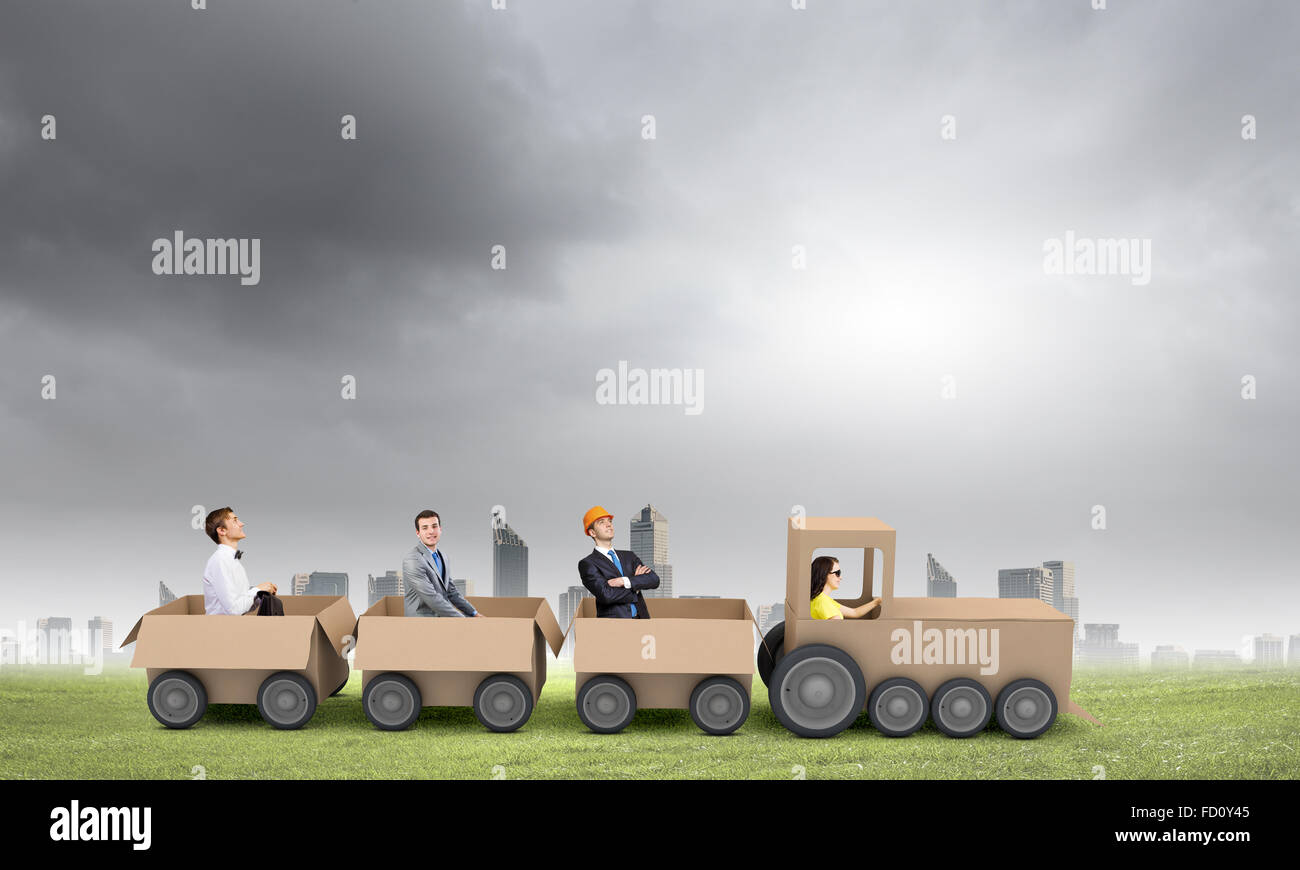Business people riding carton train. Teamwork concept Stock Photo - Alamy