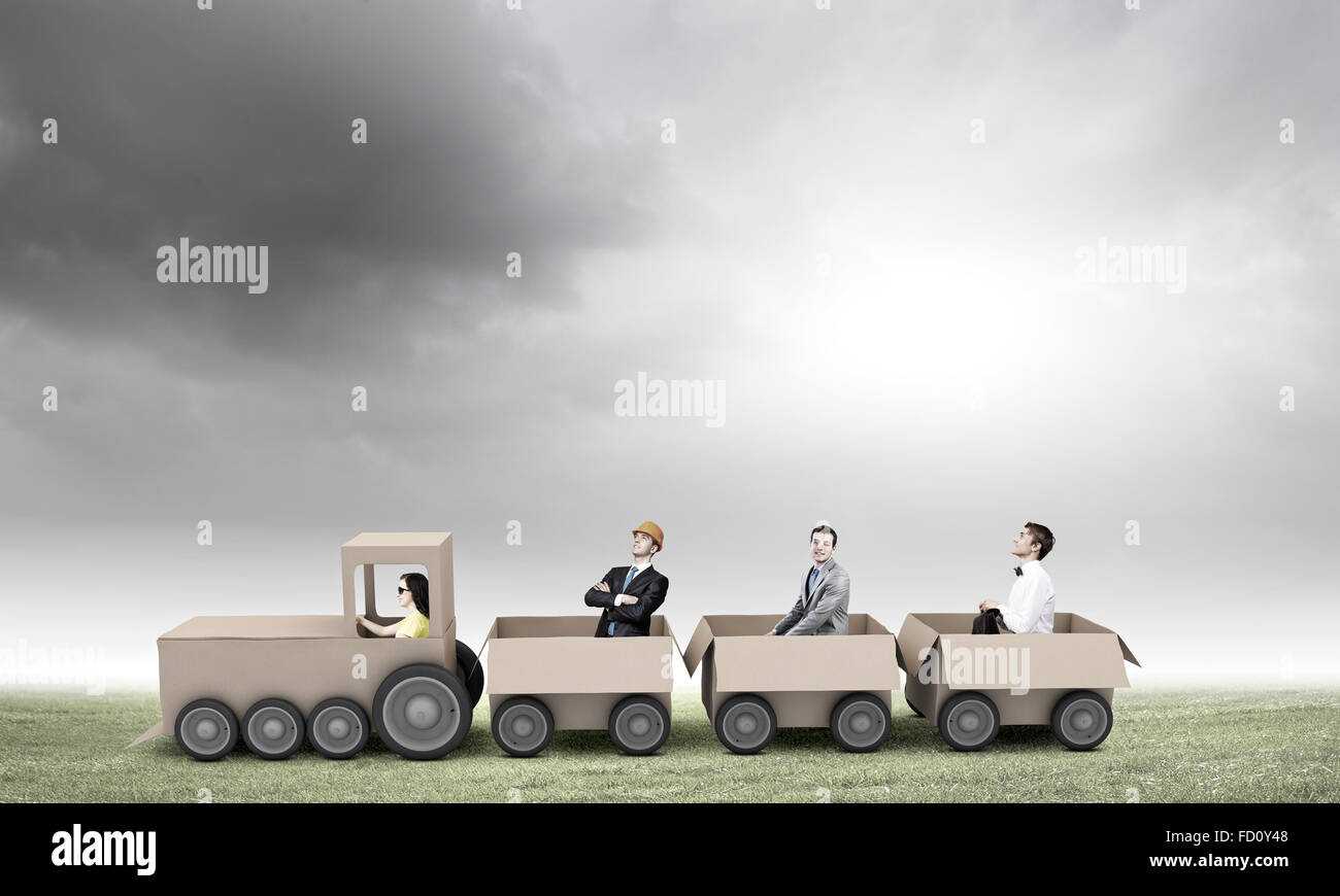 Business people riding carton train. Teamwork concept Stock Photo - Alamy
