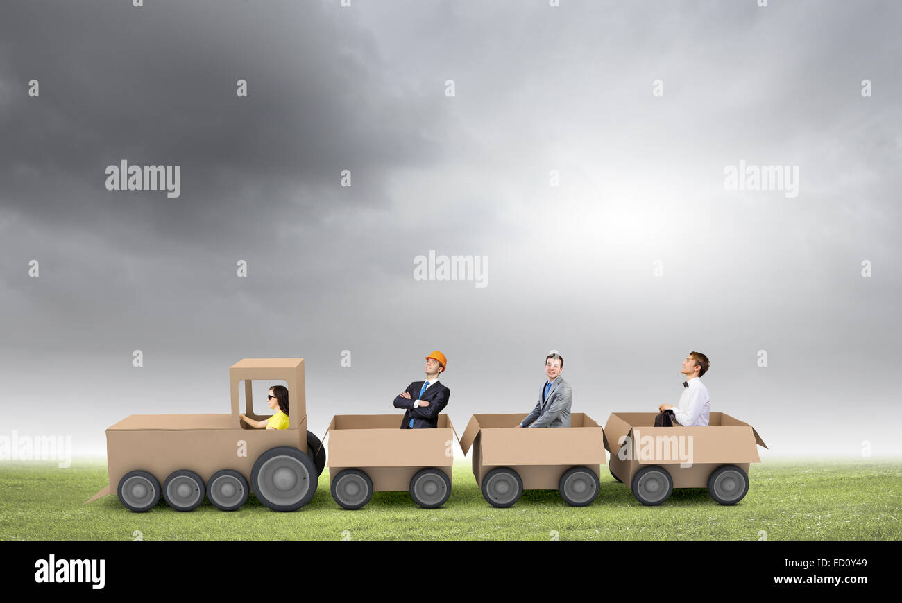 Business people riding carton train. Teamwork concept Stock Photo - Alamy