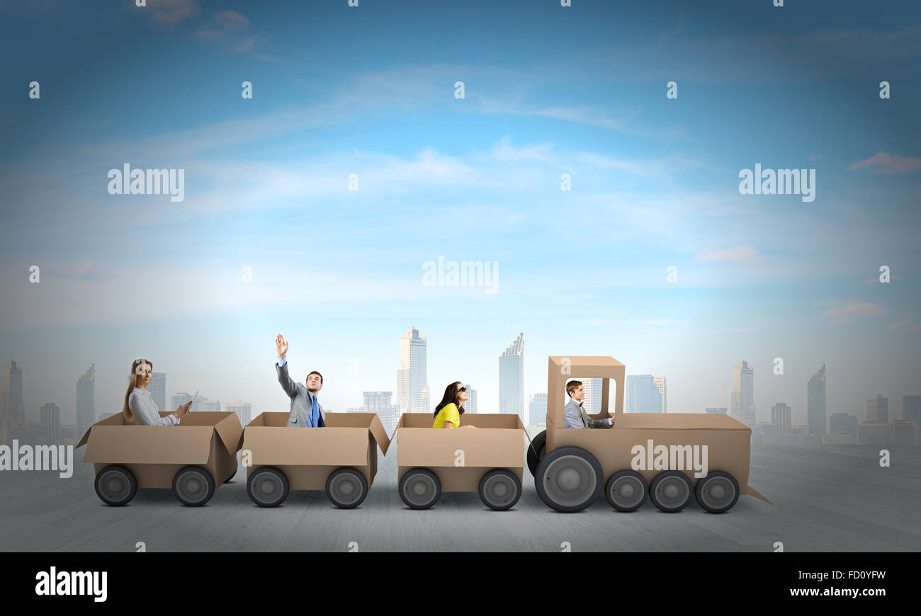 Business people riding carton train. Teamwork concept Stock Photo - Alamy