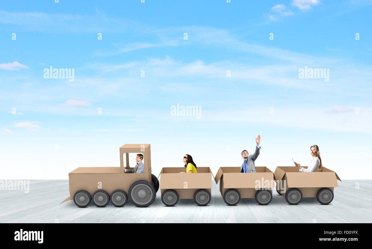 Business people riding carton train. Teamwork concept Stock Photo - Alamy