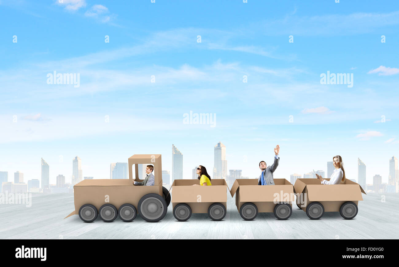 Business people riding carton train. Teamwork concept Stock Photo - Alamy