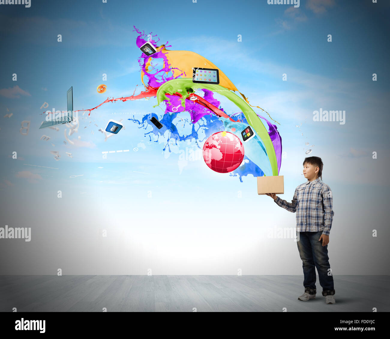 Young boy splashing colorful paint from bucket Stock Photo - Alamy