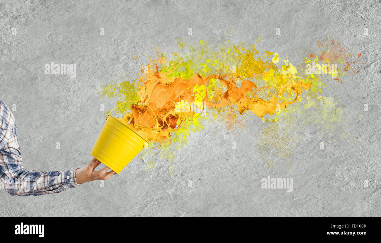 Close up of hand splashing colorful paint from bucket Stock Photo - Alamy