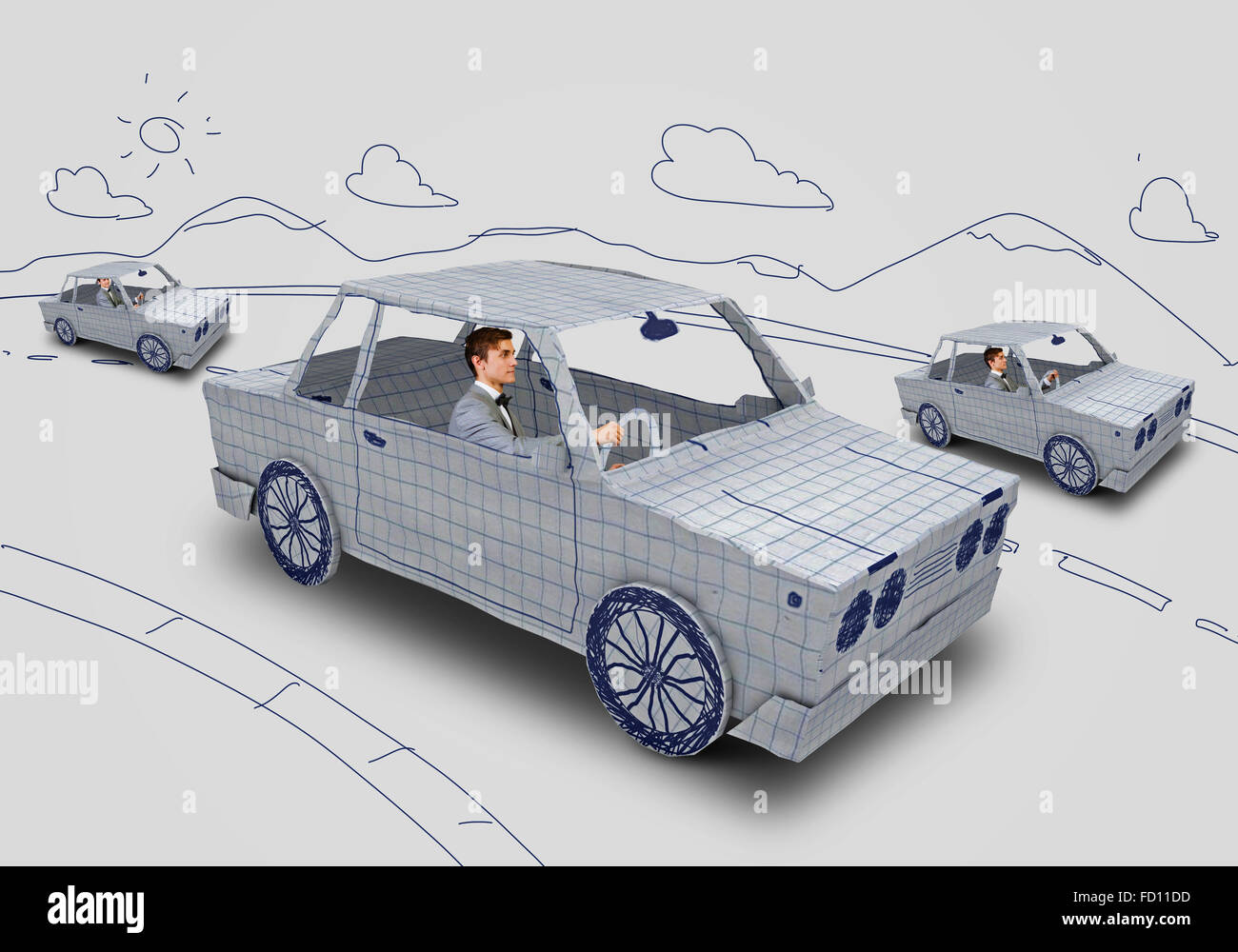 Young man driving car made of sheet of paper Stock Photo - Alamy