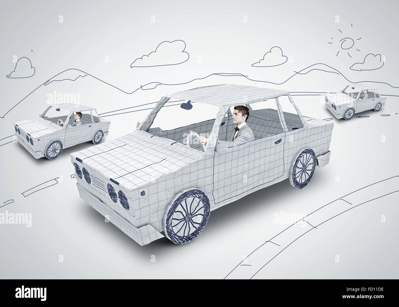 Young man driving car made of sheet of paper Stock Photo - Alamy