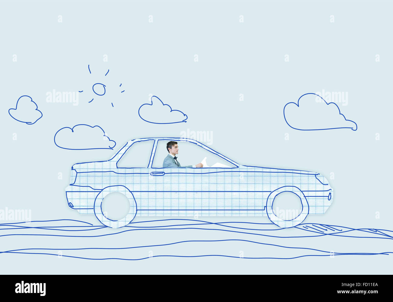 Young man driving car made of sheet of paper Stock Photo - Alamy