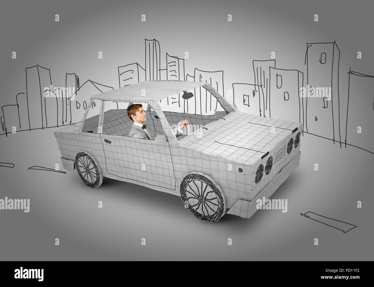 Young man driving car made of sheet of paper Stock Photo - Alamy