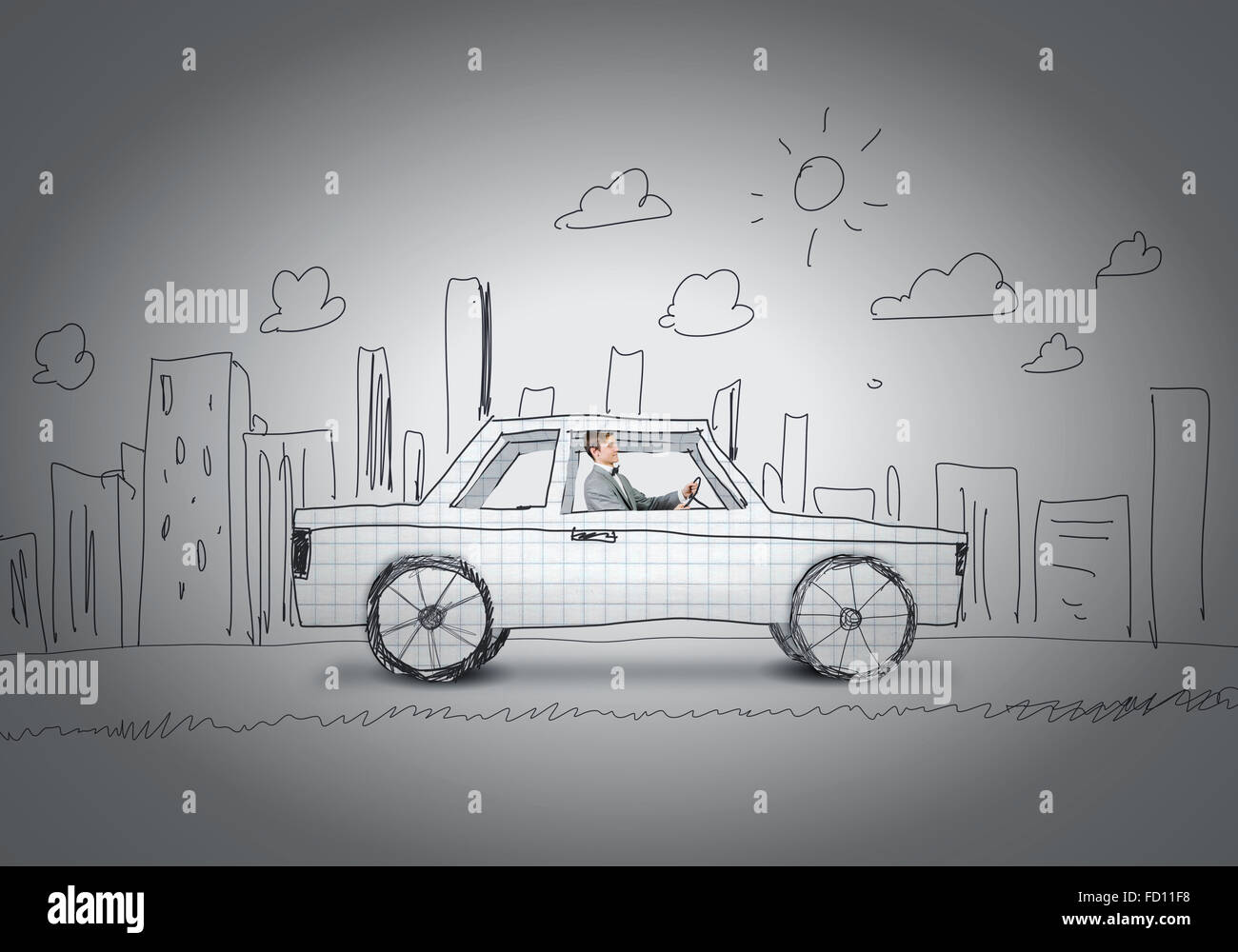 Young man driving car made of sheet of paper Stock Photo - Alamy