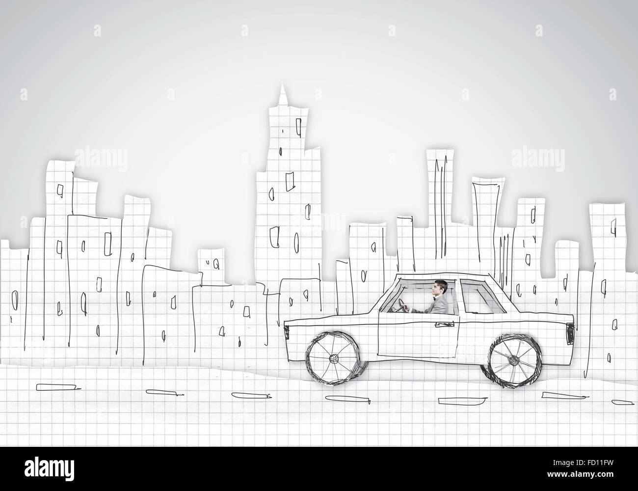 Young man driving car made of sheet of paper Stock Photo - Alamy