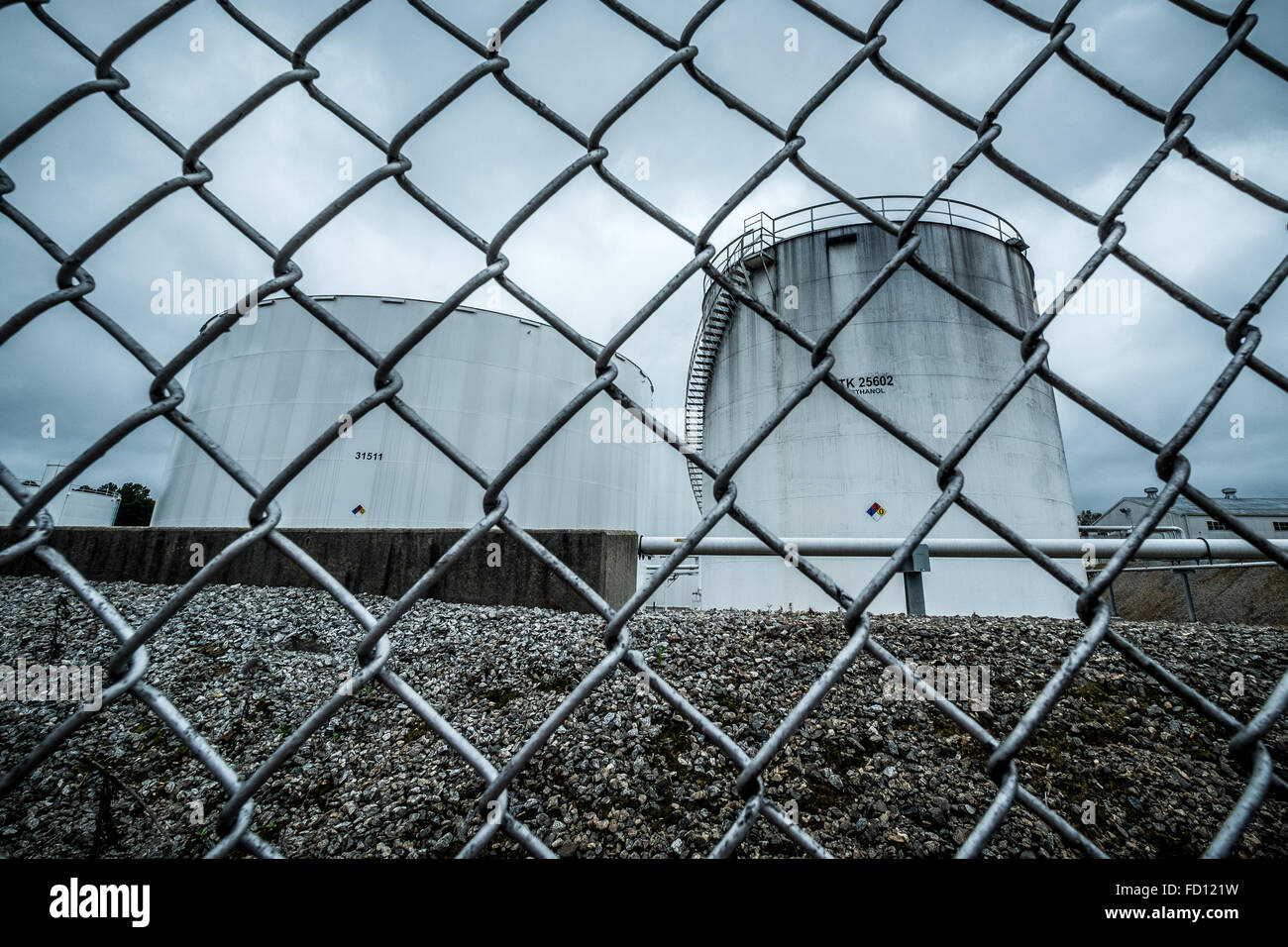 oil tank field separated by a fence Stock Photo - Alamy