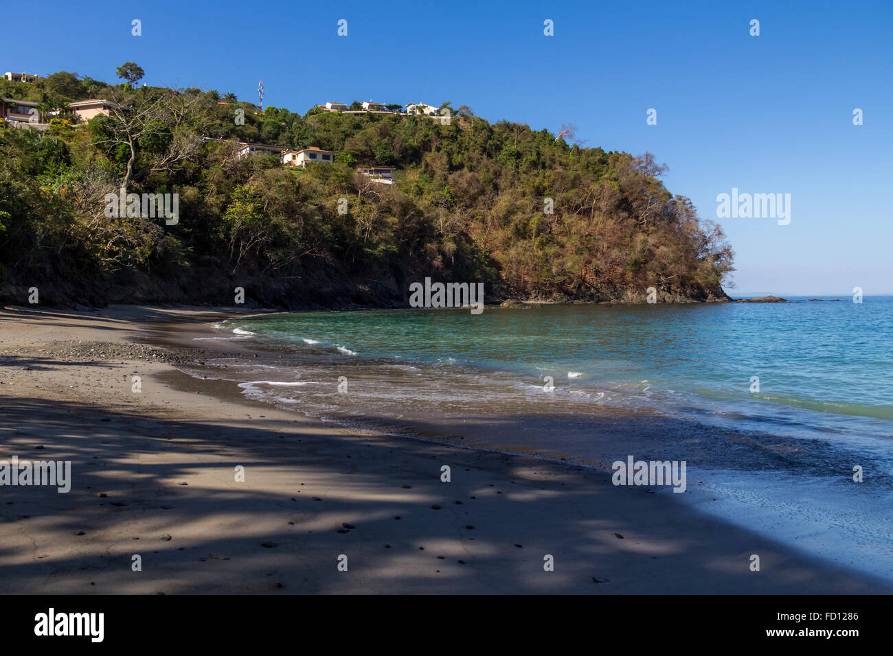 Morning on a beach in Costa Rica Pacific whit houses view Stock Photo ...