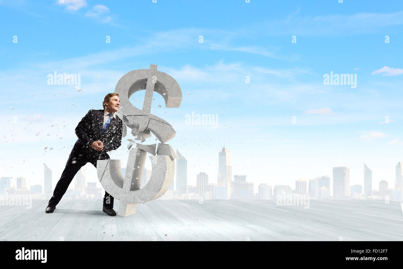 Young businessman breaking stone dollar sign. Currency concept Stock ...