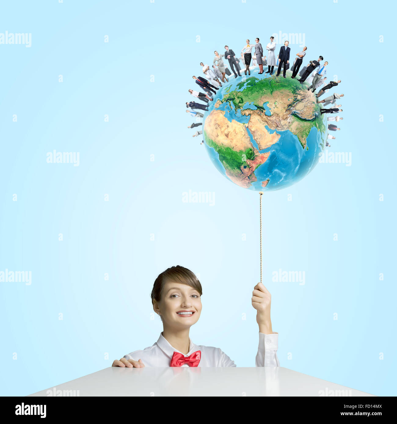 Young smiling woman holding balloon colored like Earth planet. Elements ...