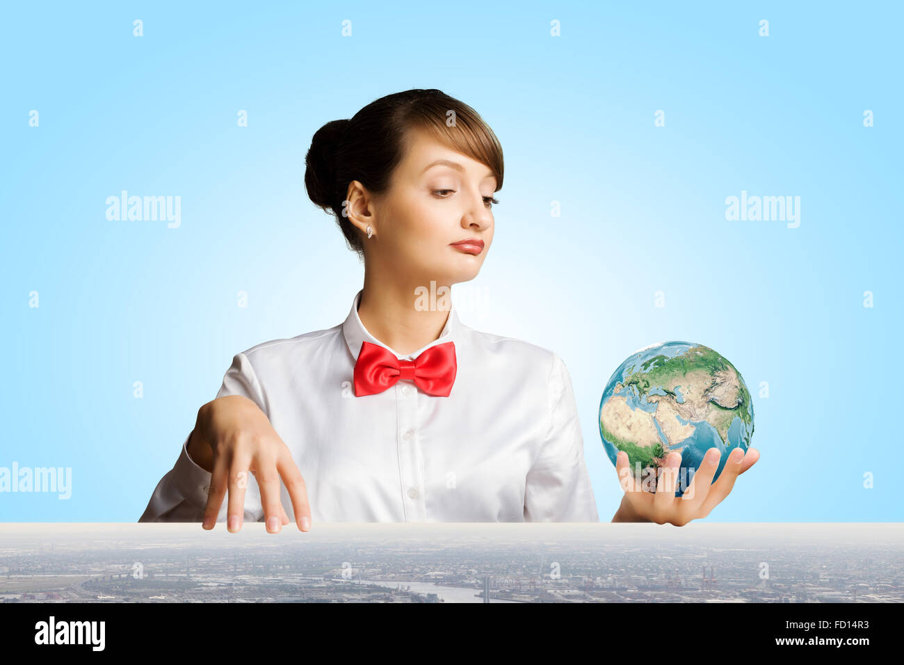 Young smiling woman holding Earth planet in hand. Elements of this ...