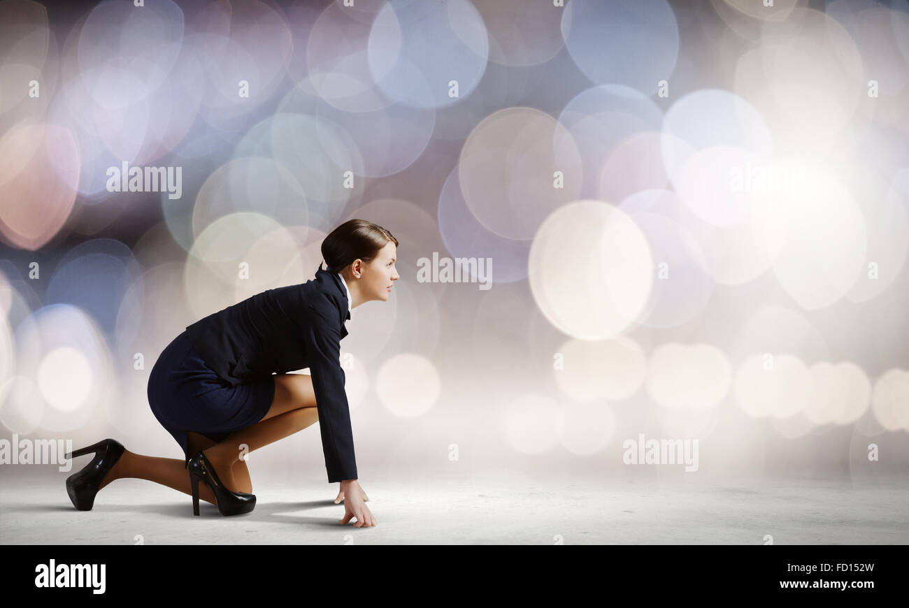 Side view of businesswoman standing in start position Stock Photo - Alamy