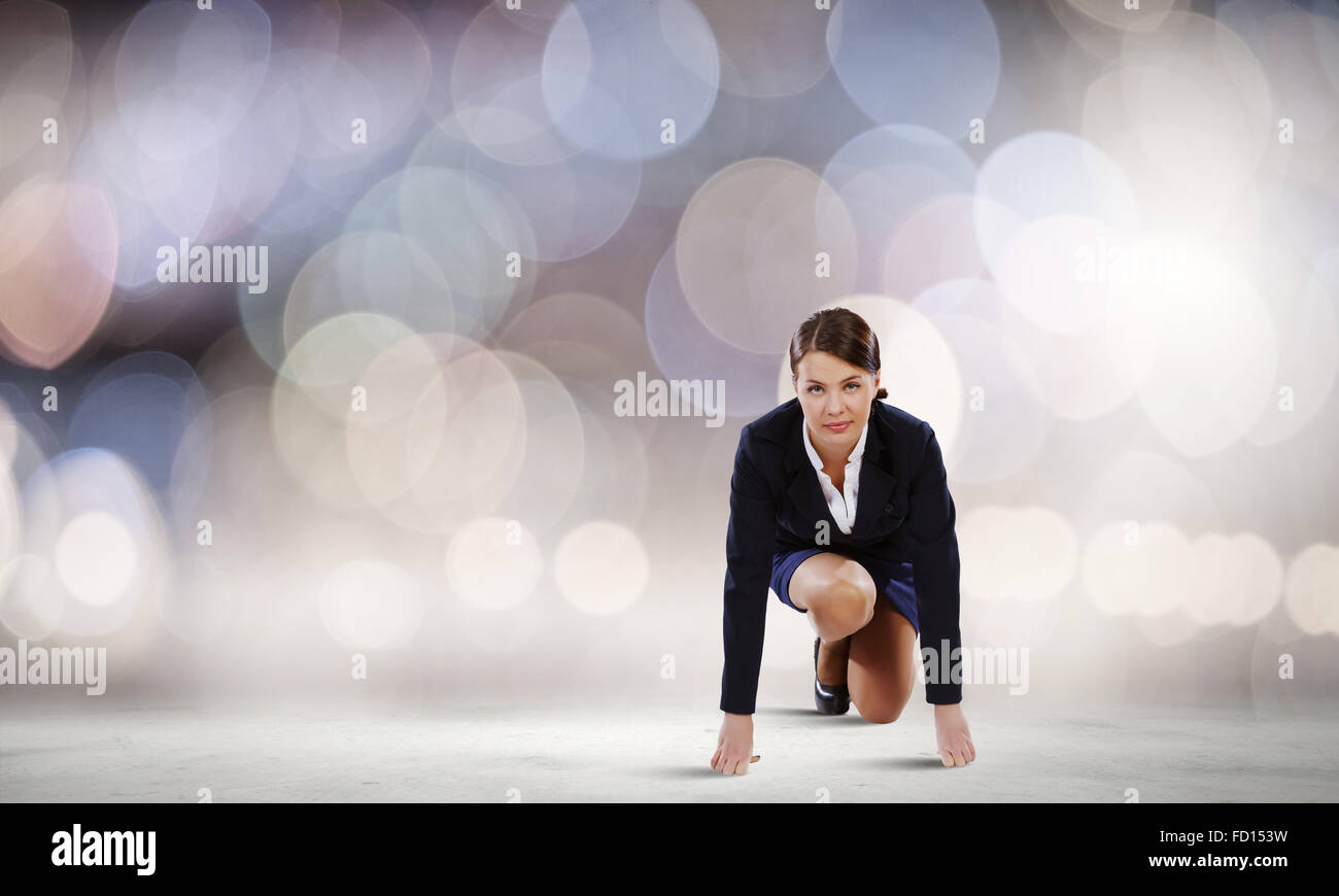 Young attractive businesswoman standing in start position Stock Photo ...