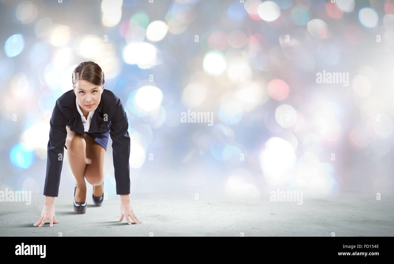 Young attractive businesswoman standing in start position Stock Photo ...