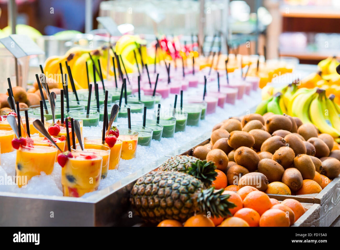 Delicious sweet cocktails and fresh fruits in the shop with takeaway ...