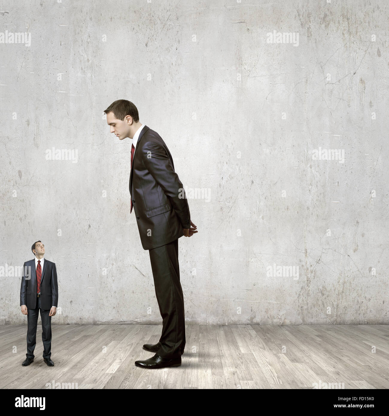 Two businessman of different size. Leadership concept Stock Photo - Alamy