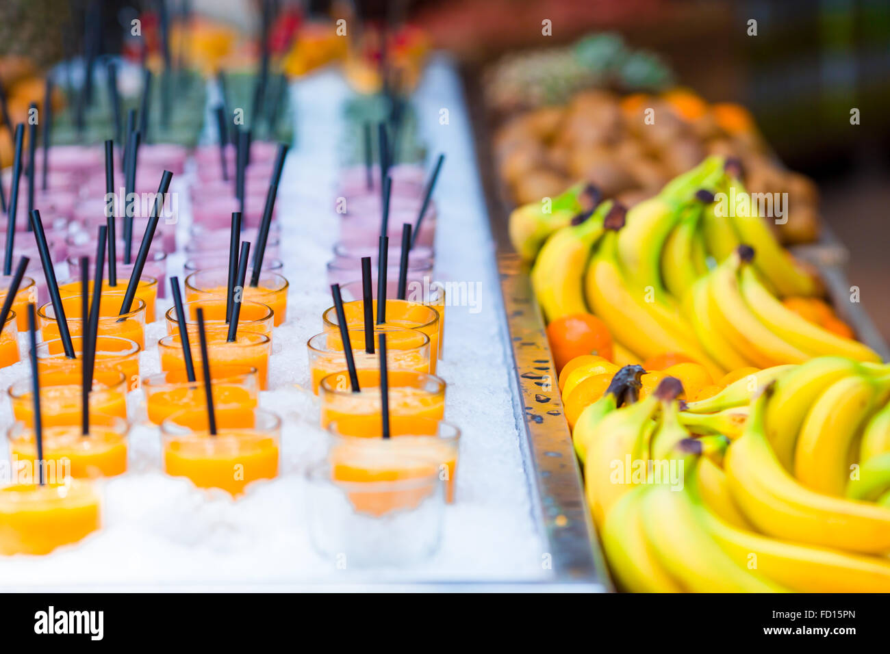 Delicious sweet cocktails and fresh fruits in the shop with takeaway ...