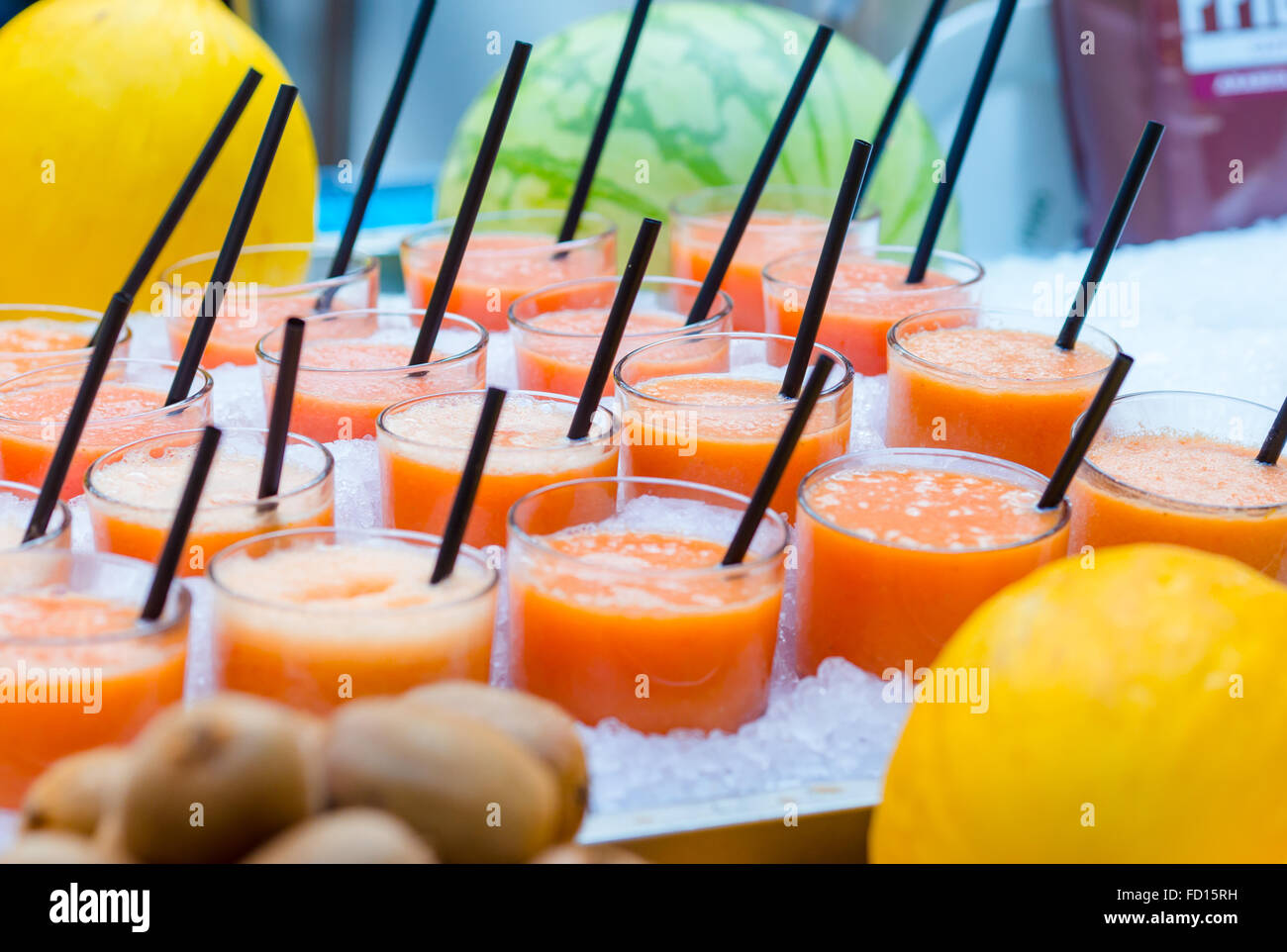 Delicious sweet cocktails and fresh fruits in the shop with takeaway ...