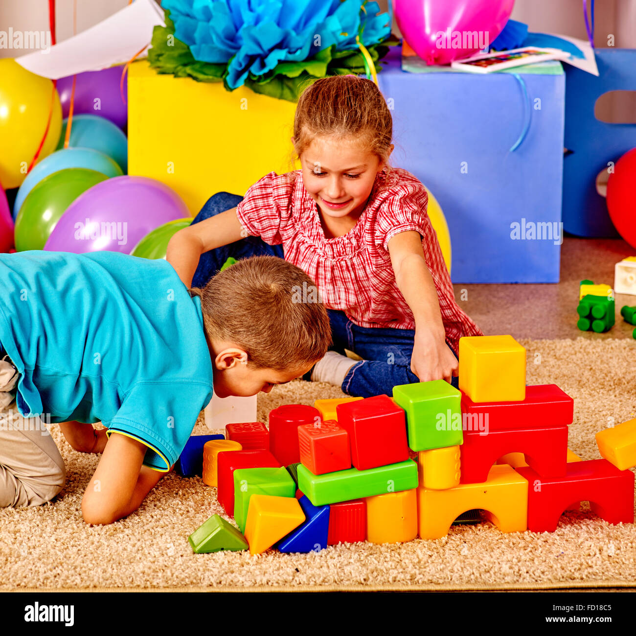 Group children game blocks on floor Stock Photo - Alamy