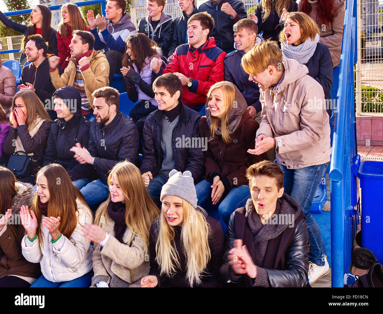 Sport fans clapping and singing on tribunes Stock Photo - Alamy