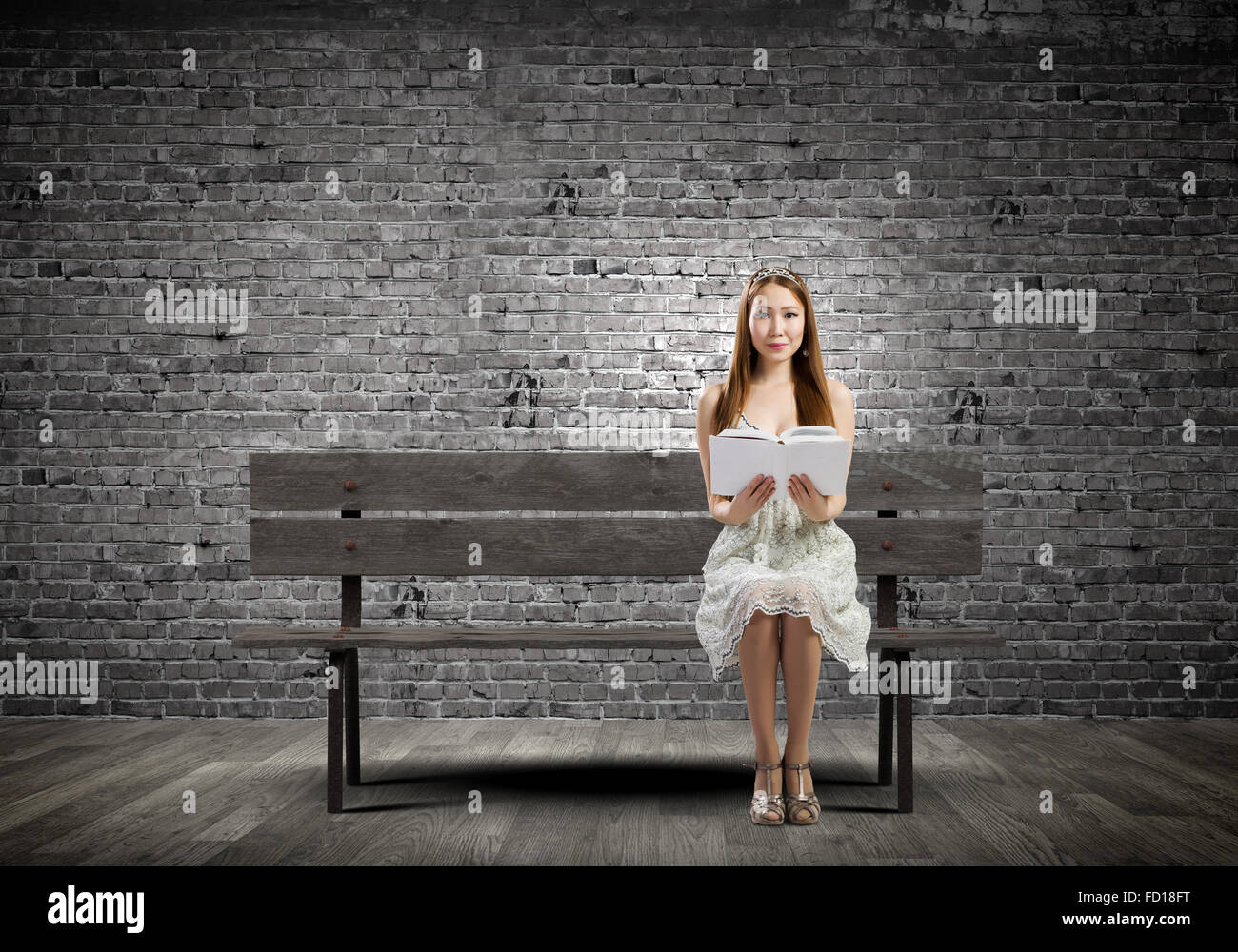 Asian pretty woman sitting on bench and reading book Stock Photo - Alamy