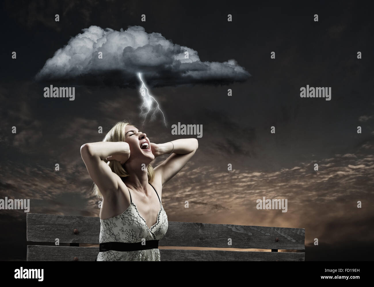 Young woman sitting on bench closing ears with palms and screaming ...