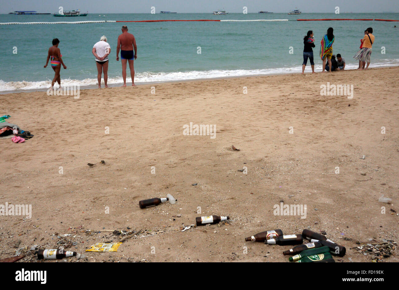 Empty beer bottles left abandoned littering the beach in Pattaya ...