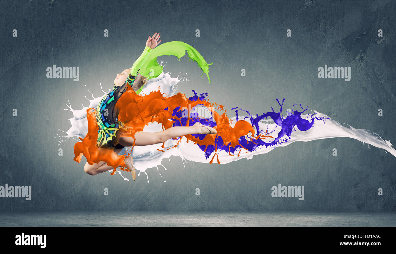 Little cute girl gymnast making high jump Stock Photo - Alamy