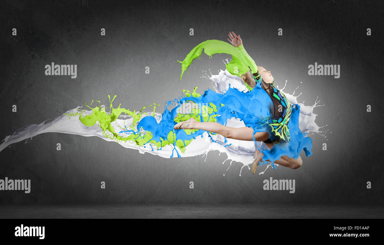 Little cute girl gymnast making high jump Stock Photo - Alamy