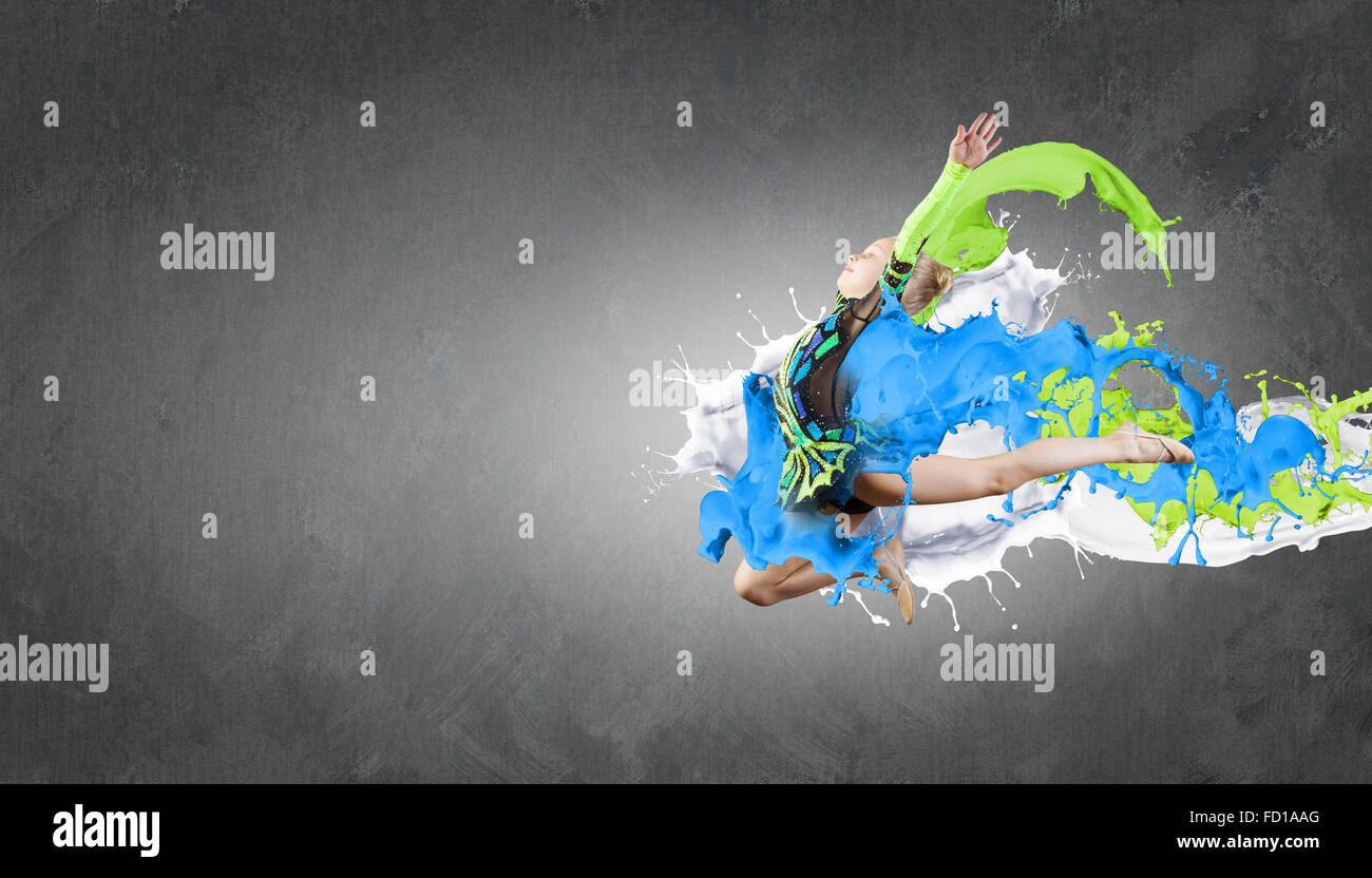 Little cute girl gymnast making high jump Stock Photo - Alamy