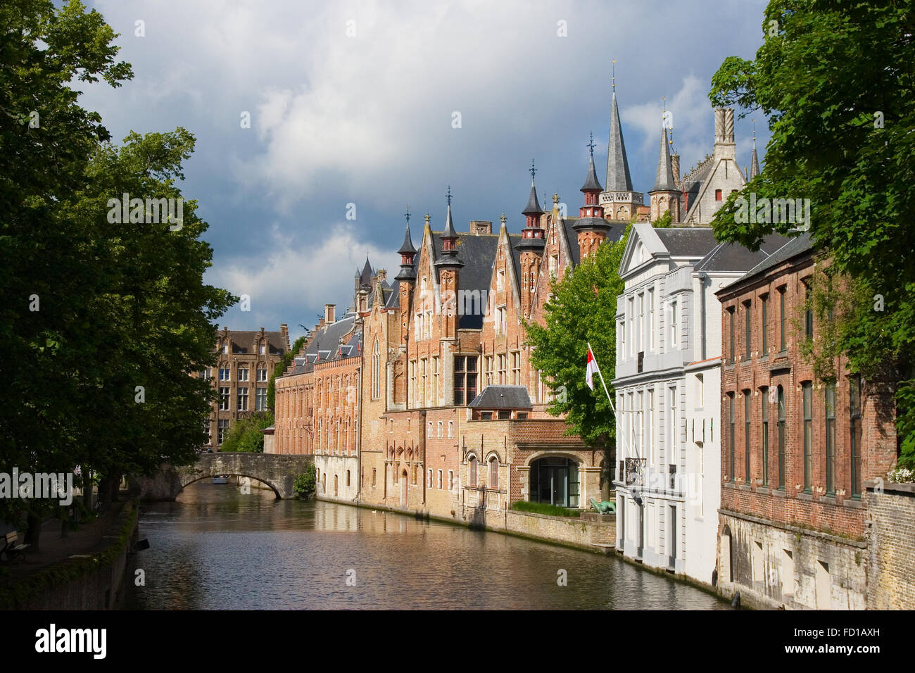 Medieval bridge over canal and flemish houses in Brugge, Belgium Stock ...