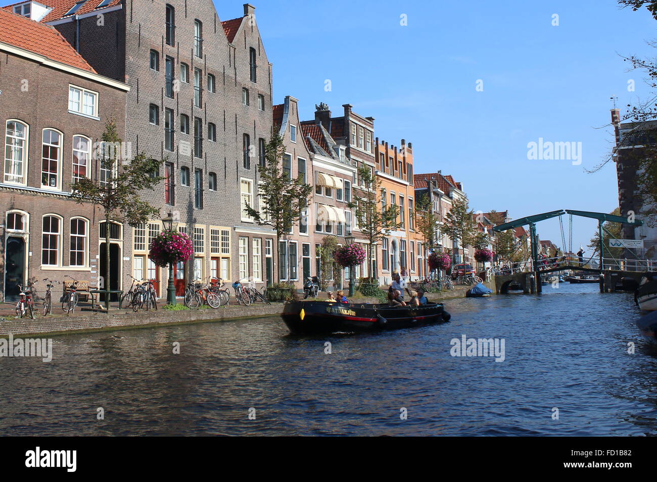 Boat with tourists on Oude Rijn canal in the historical centre of ...