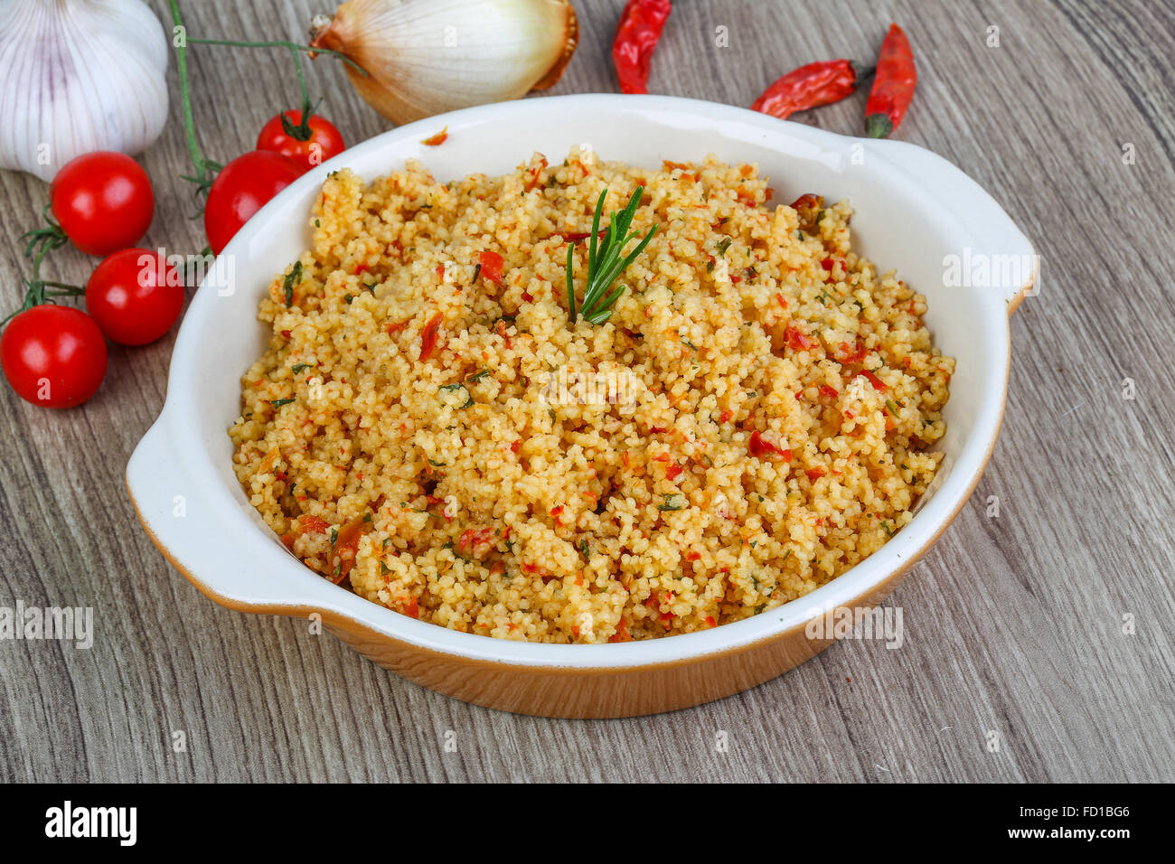 Arabic traditional cuisine - Couscous with tomato and green onion Stock ...