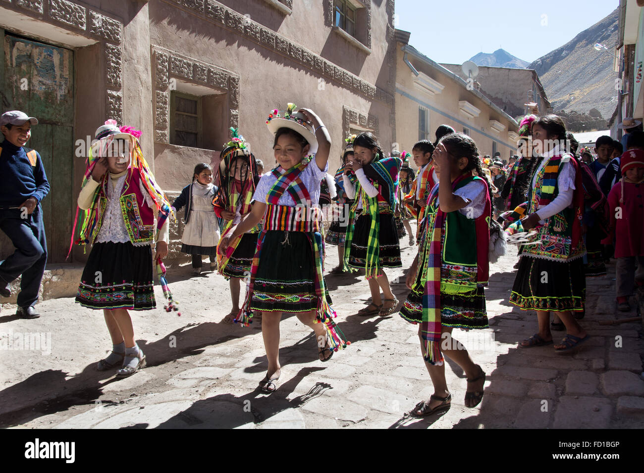 Traditionally dressed children in a festive procession during a Fiesta ...